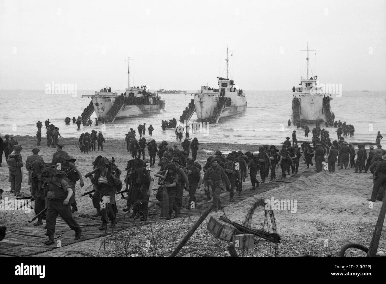 Troops coming ashore from landing ships during an invasion exercise in ...