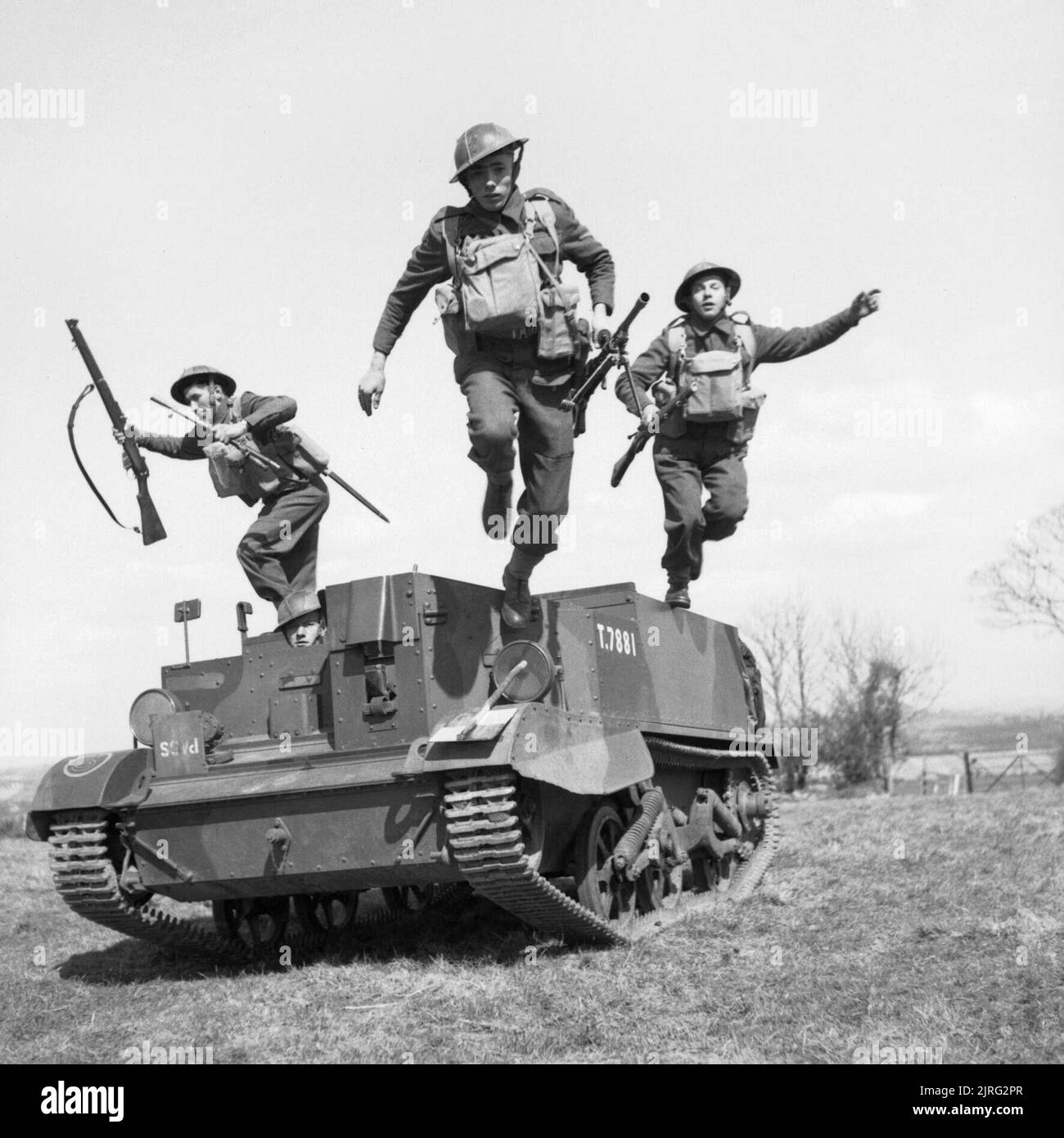 Troops of the 2nd Monmouthshire Regiment leap from their Universal ...