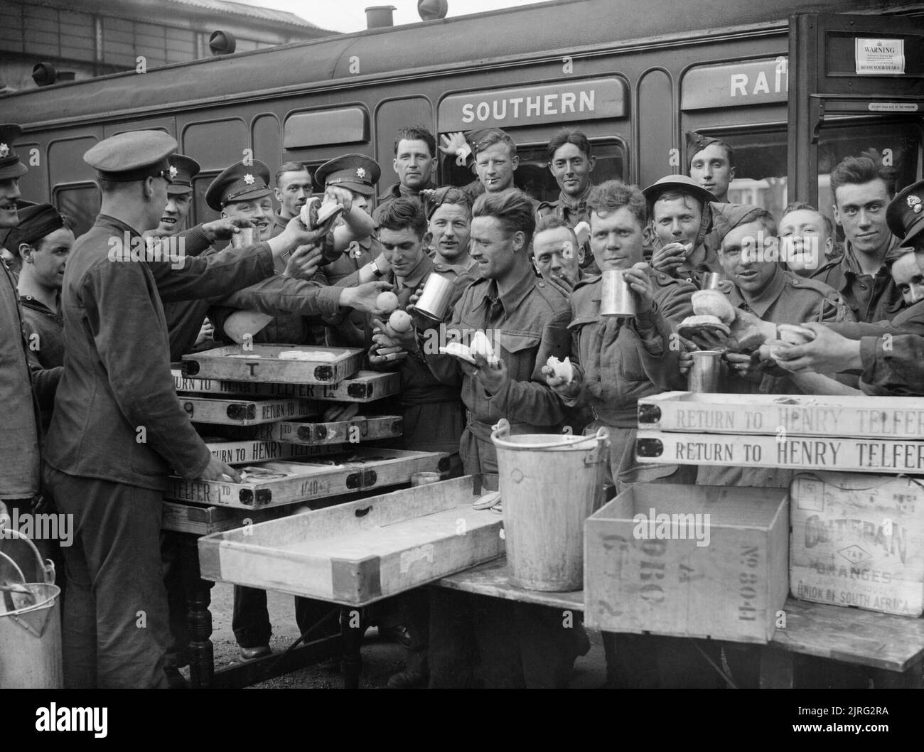 Troops evacuated from Dunkirk enjoying tea and other refreshments at ...