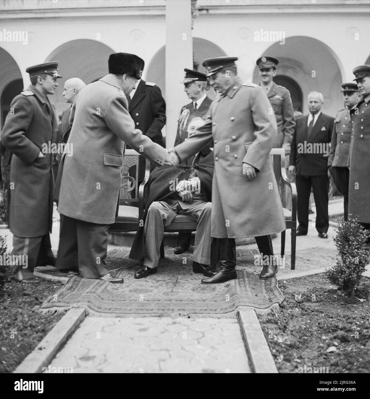 Winston Churchill greets Joseph Stalin with President Roosevelt outside ...