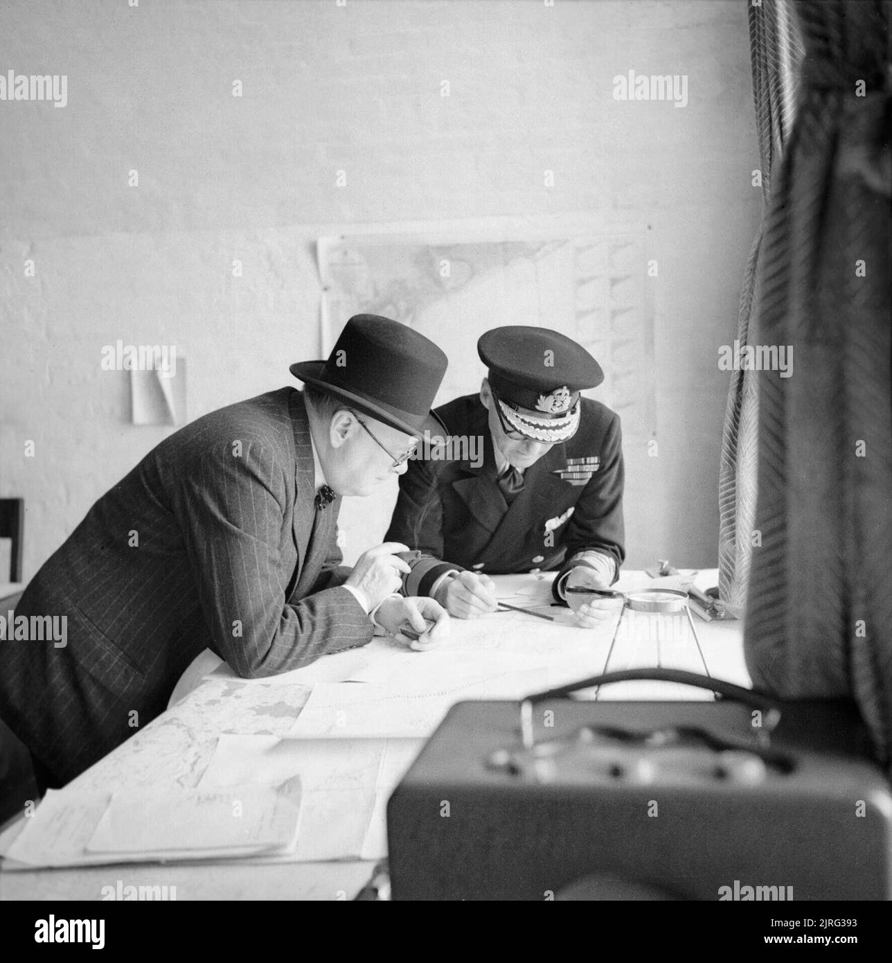 Winston Churchill studies after action reports with Vice Admiral Sir ...