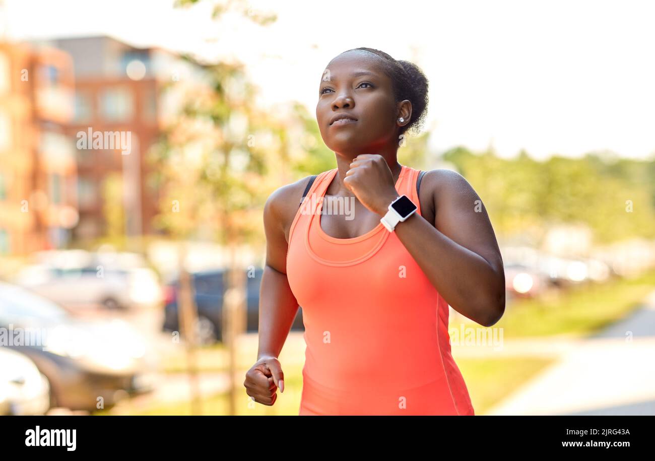 Running watch woman hi-res stock photography and images - Alamy