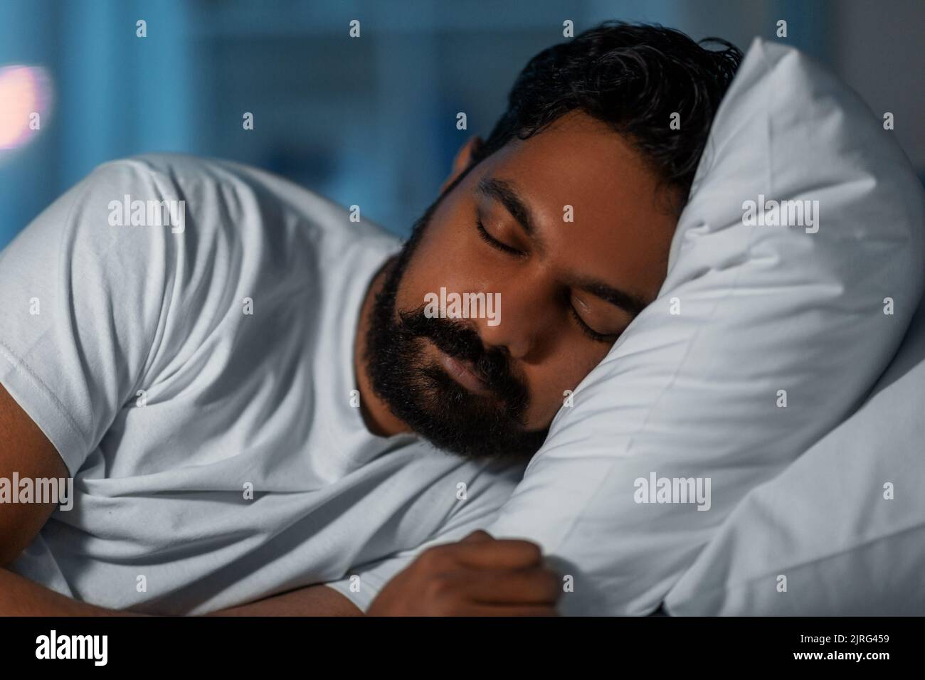 indian man sleeping in bed at home at night Stock Photo - Alamy