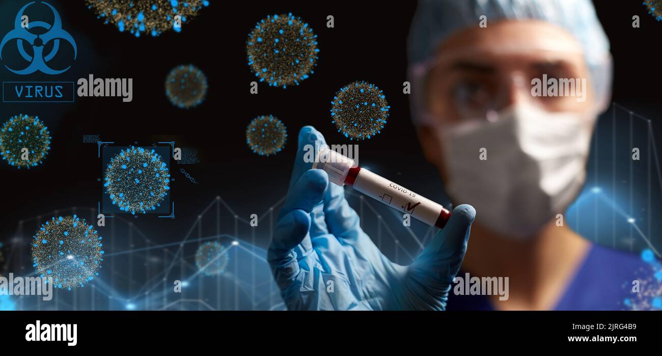Doctor holding beaker coronavirus blood hi-res stock photography and ...
