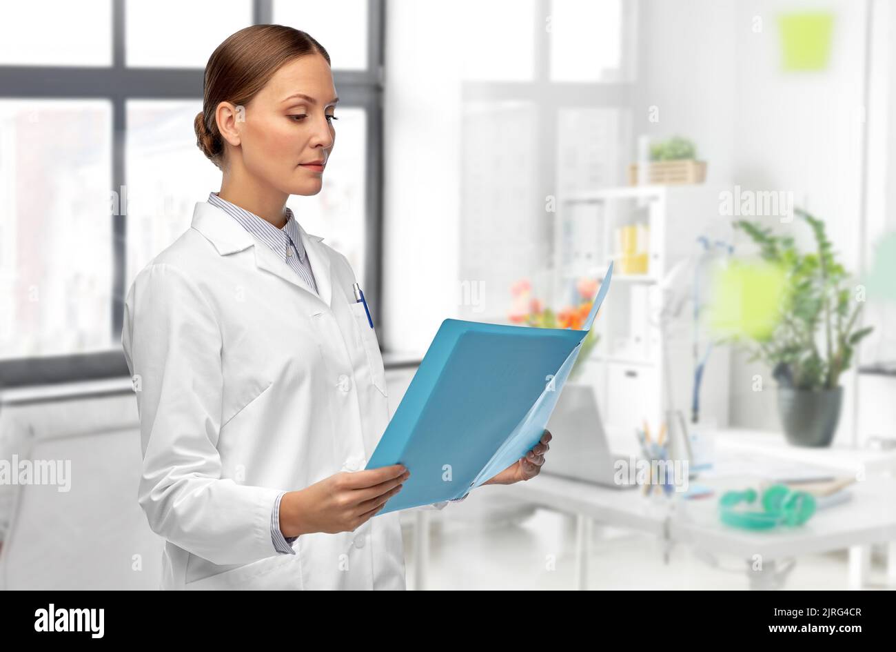 female doctor with folder at hospital Stock Photo - Alamy