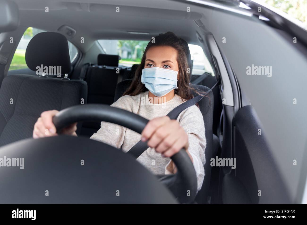 Woman driver mask car hi-res stock photography and images - Alamy