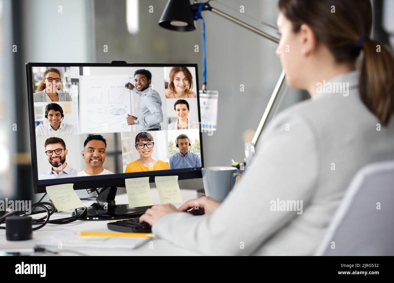 Businesswoman having video conference on laptop with her colleague ...