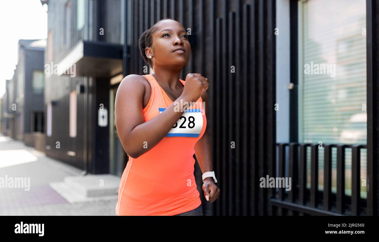 young african american woman running marathon Stock Photo - Alamy