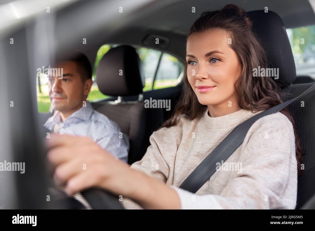 woman and driving school instructor in car Stock Photo - Alamy