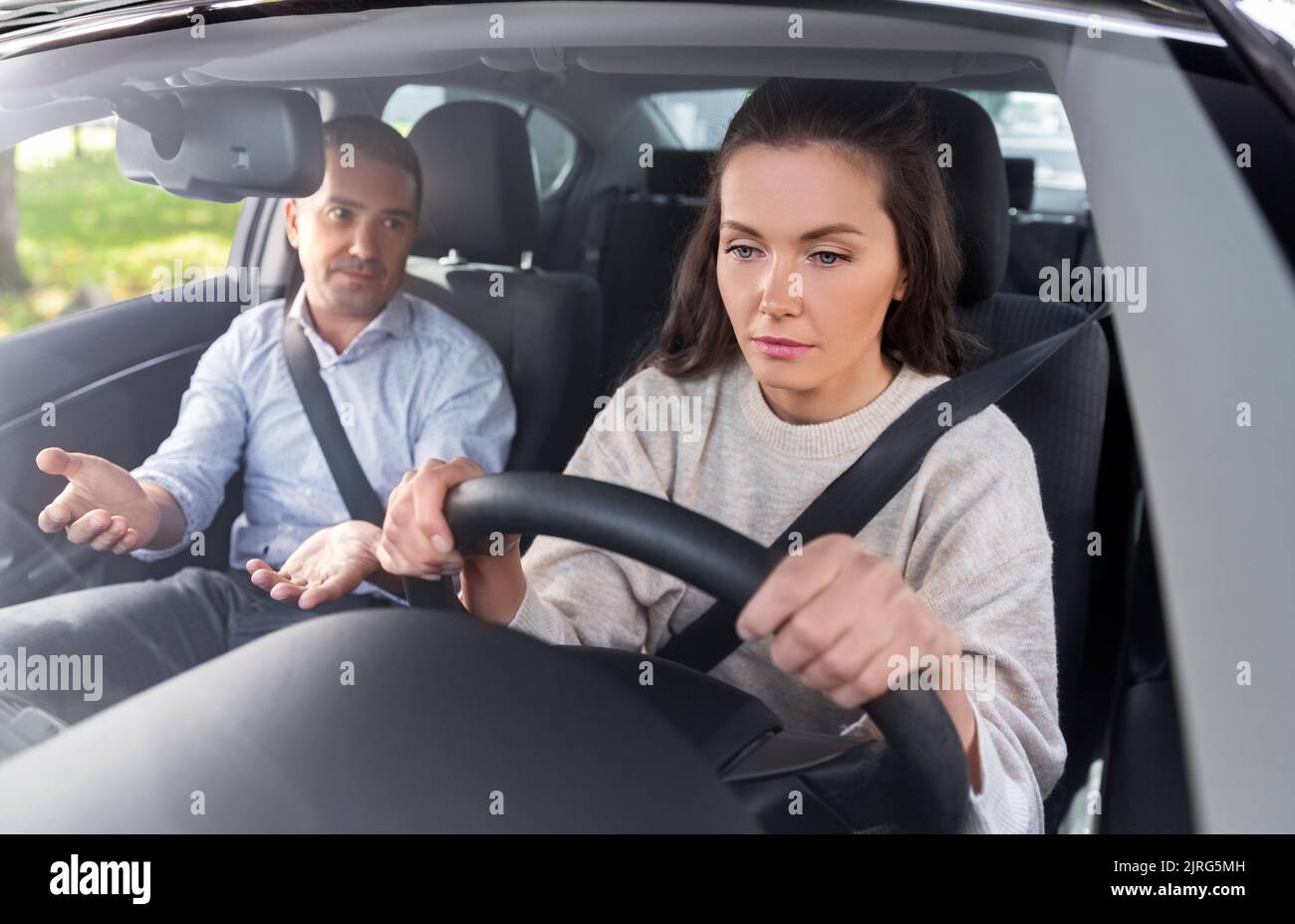 car driving school instructor teaching woman Stock Photo - Alamy