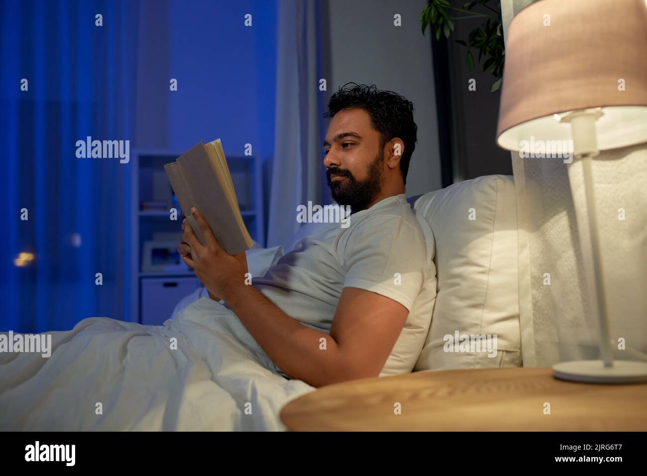 Indian man reading hi-res stock photography and images - Alamy