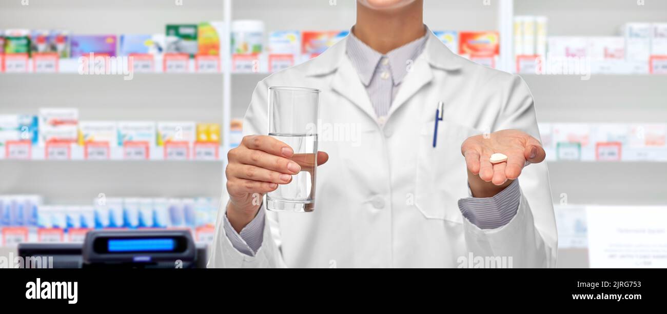 female doctor with medicine and water pharmacy Stock Photo - Alamy