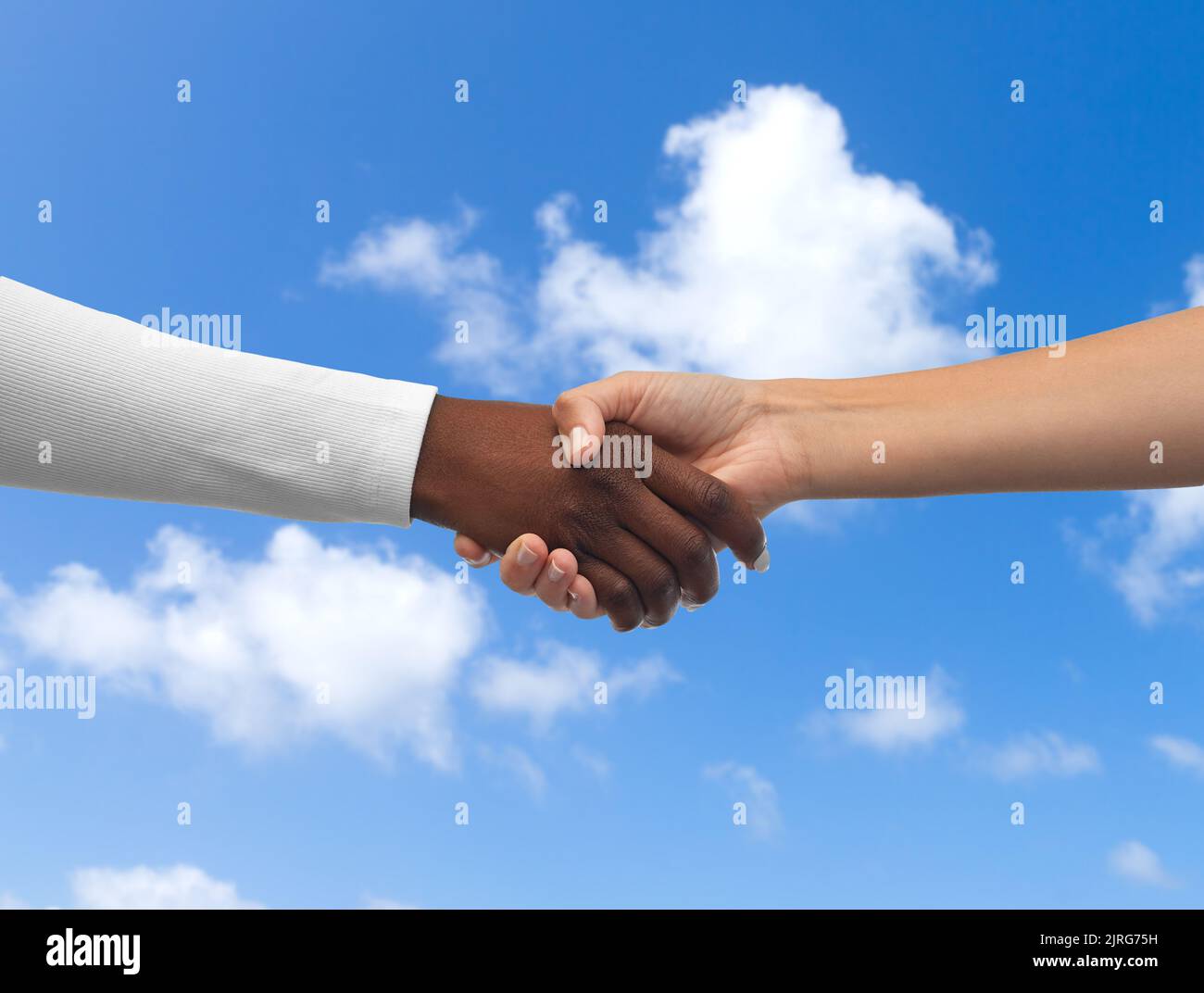 handshake of black and white hands Stock Photo - Alamy