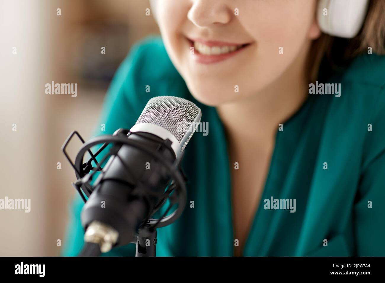 Woman headphones speaking microphone hi-res stock photography and ...