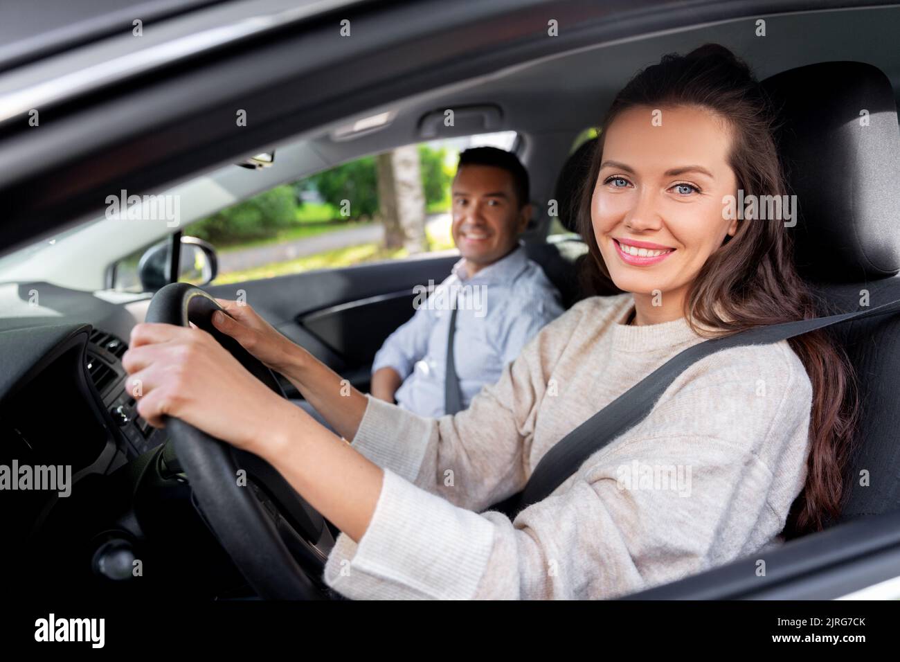 car driving school instructor teaching woman Stock Photo - Alamy