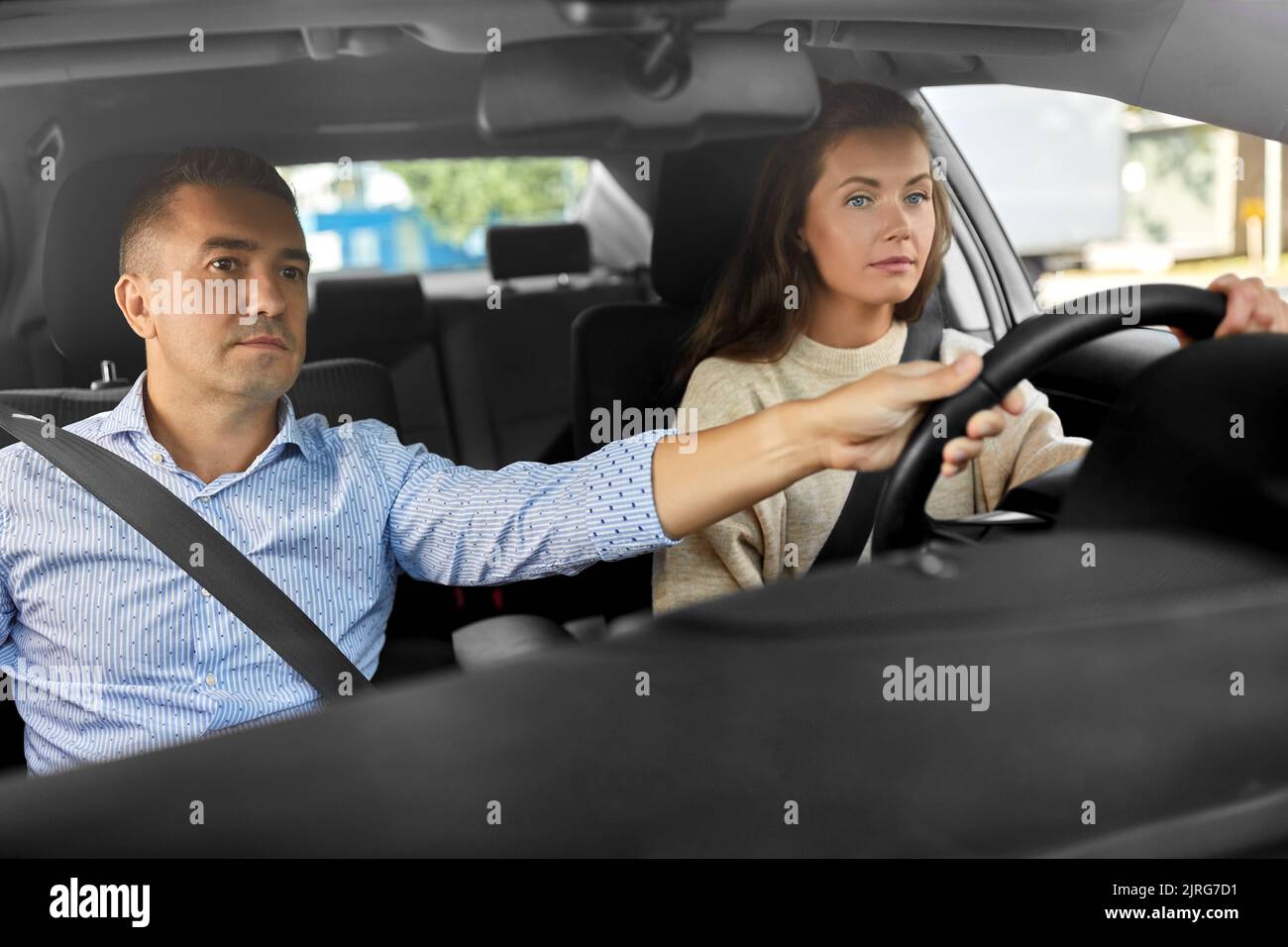car driving school instructor teaching woman Stock Photo - Alamy