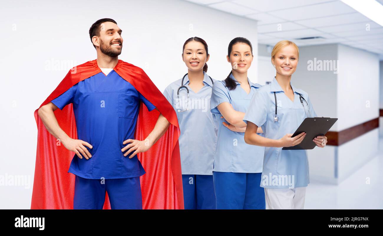 male doctor in superhero cape and nurses at clinic Stock Photo - Alamy