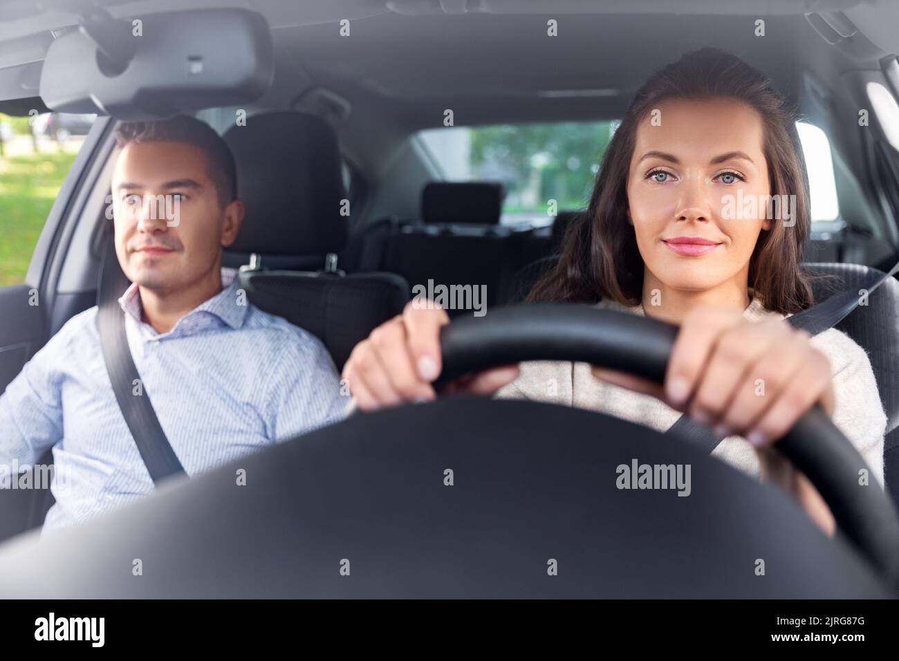 car driving school instructor teaching woman Stock Photo - Alamy