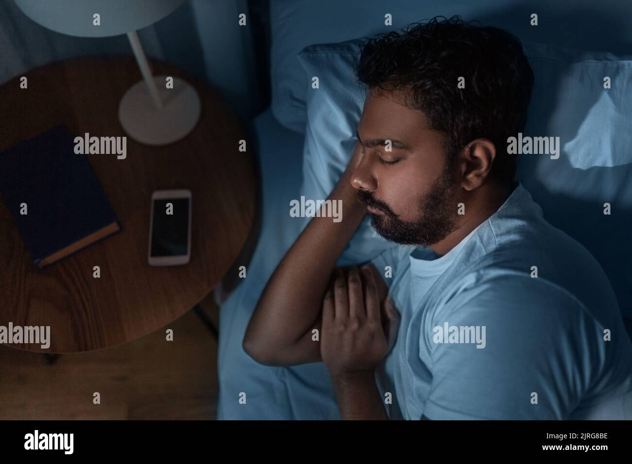 Man sleeping in bed at night hi-res stock photography and images - Alamy