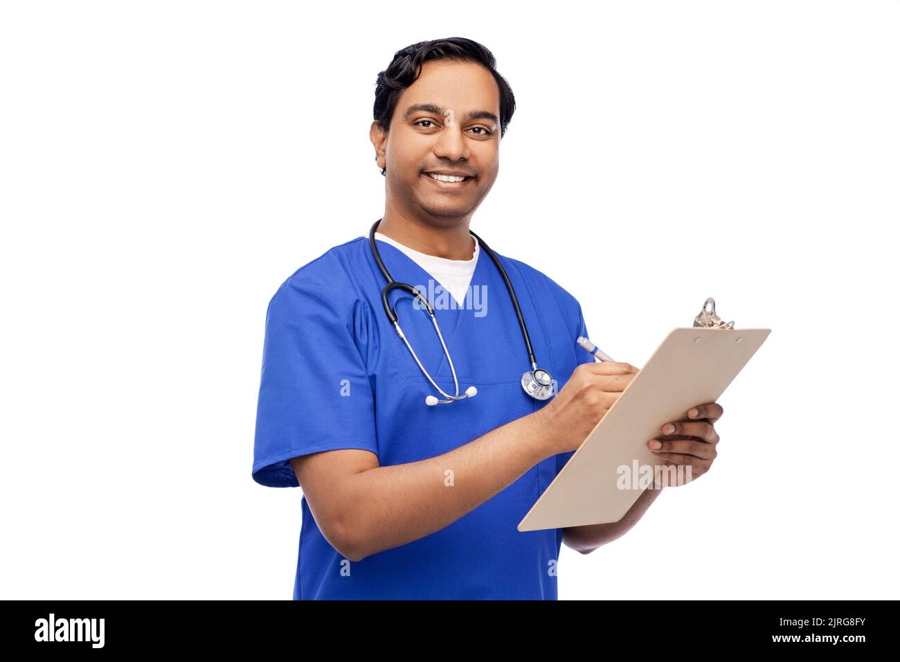 male doctor writing medical report on clipboard Stock Photo - Alamy
