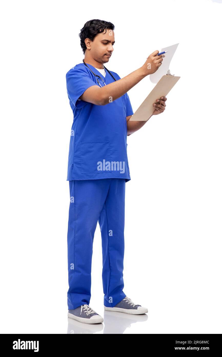 indian male doctor with report on clipboard Stock Photo - Alamy