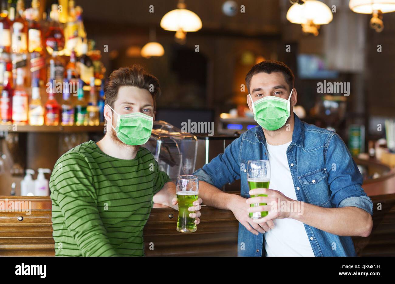 Male friends drinking green hi-res stock photography and images - Alamy