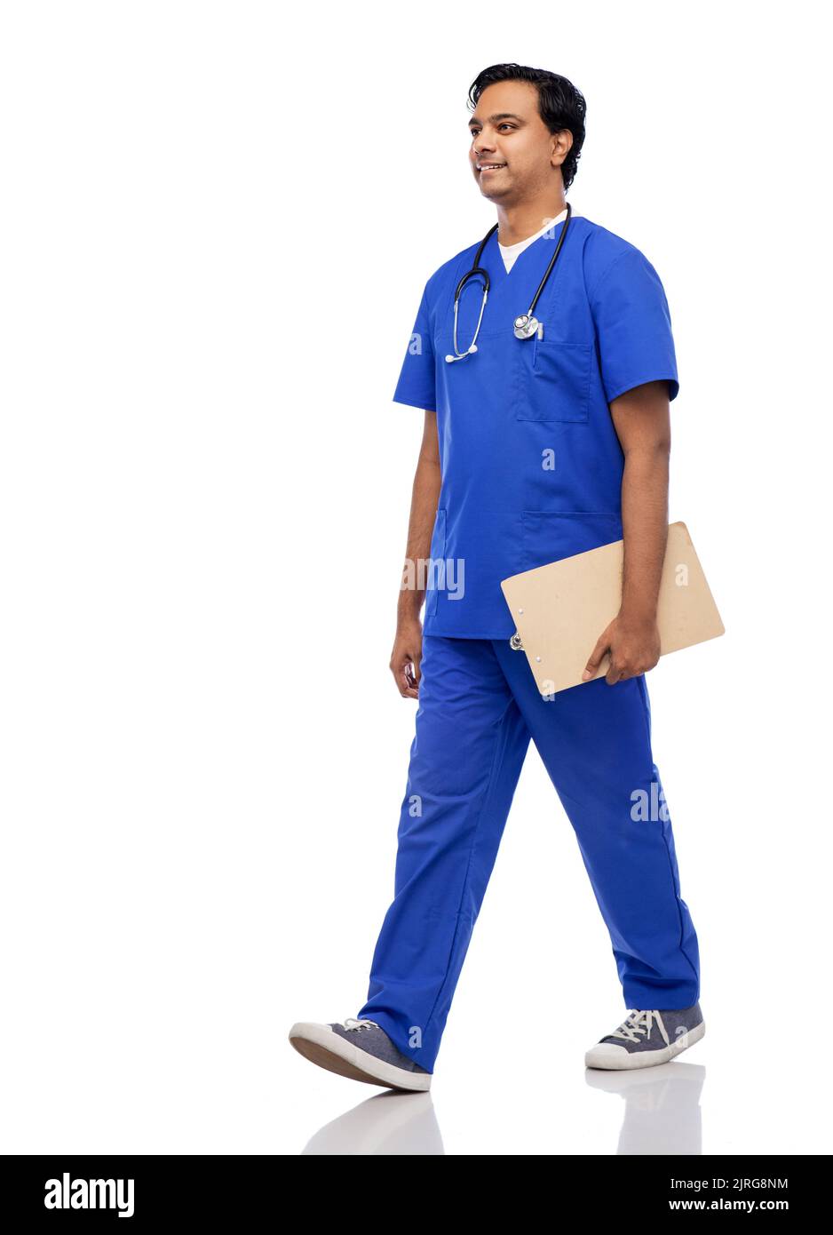 male doctor walking with clipboard and stethoscope Stock Photo - Alamy
