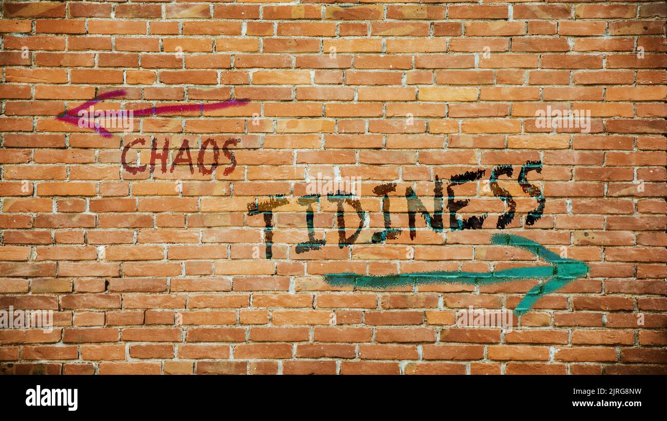 Street Sign the Direction Way to Tidiness versus Chaos Stock Photo - Alamy