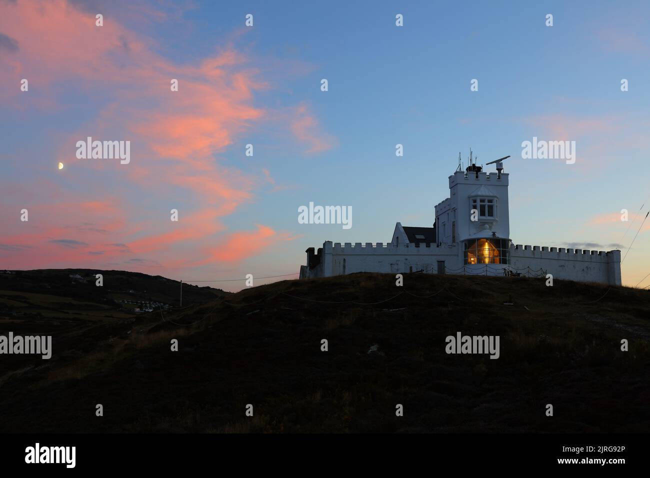 Point Lynas Lighthouse at Sunset with the Moon in the Sky. Anglesey ...