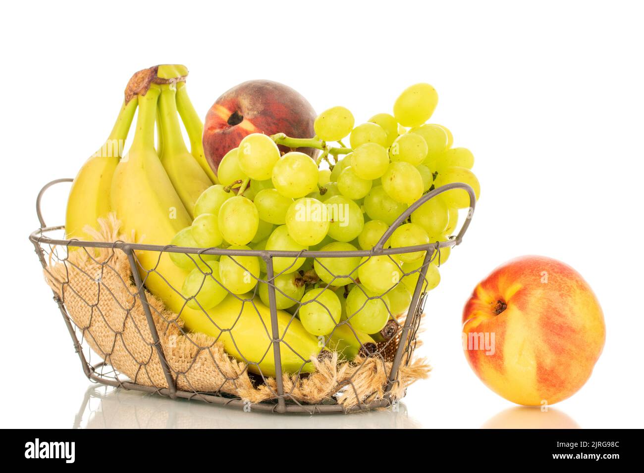 One bunch of white grapes, a bunch of bananas, an apple, a peach and a ...