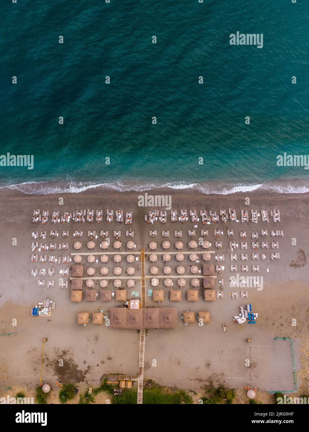 Aerial photo of a beach bar in the shore of Agiokampos beach , Greece ...