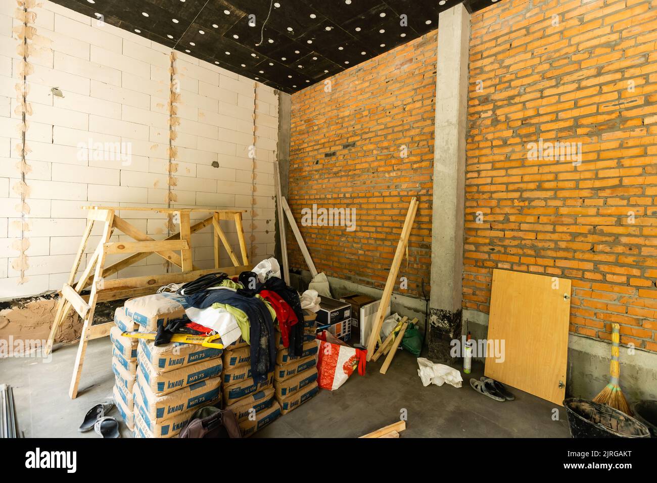 Newly renovated generic empty office space with leftover materials and ...