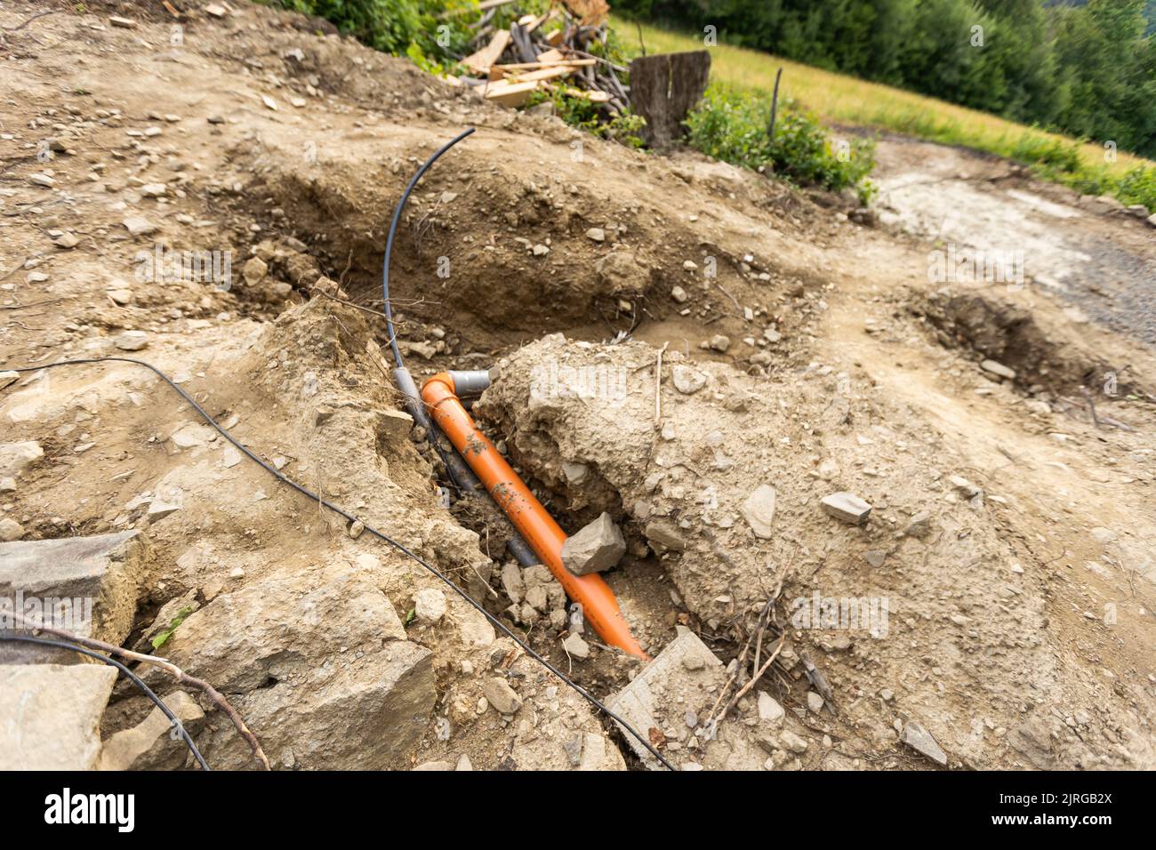 Construction site on which the excavator works. Laying water pipes ...