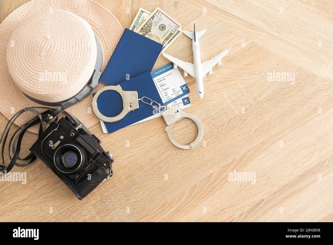 passport, tickets, toy plane, handcuffs for travel Stock Photo - Alamy