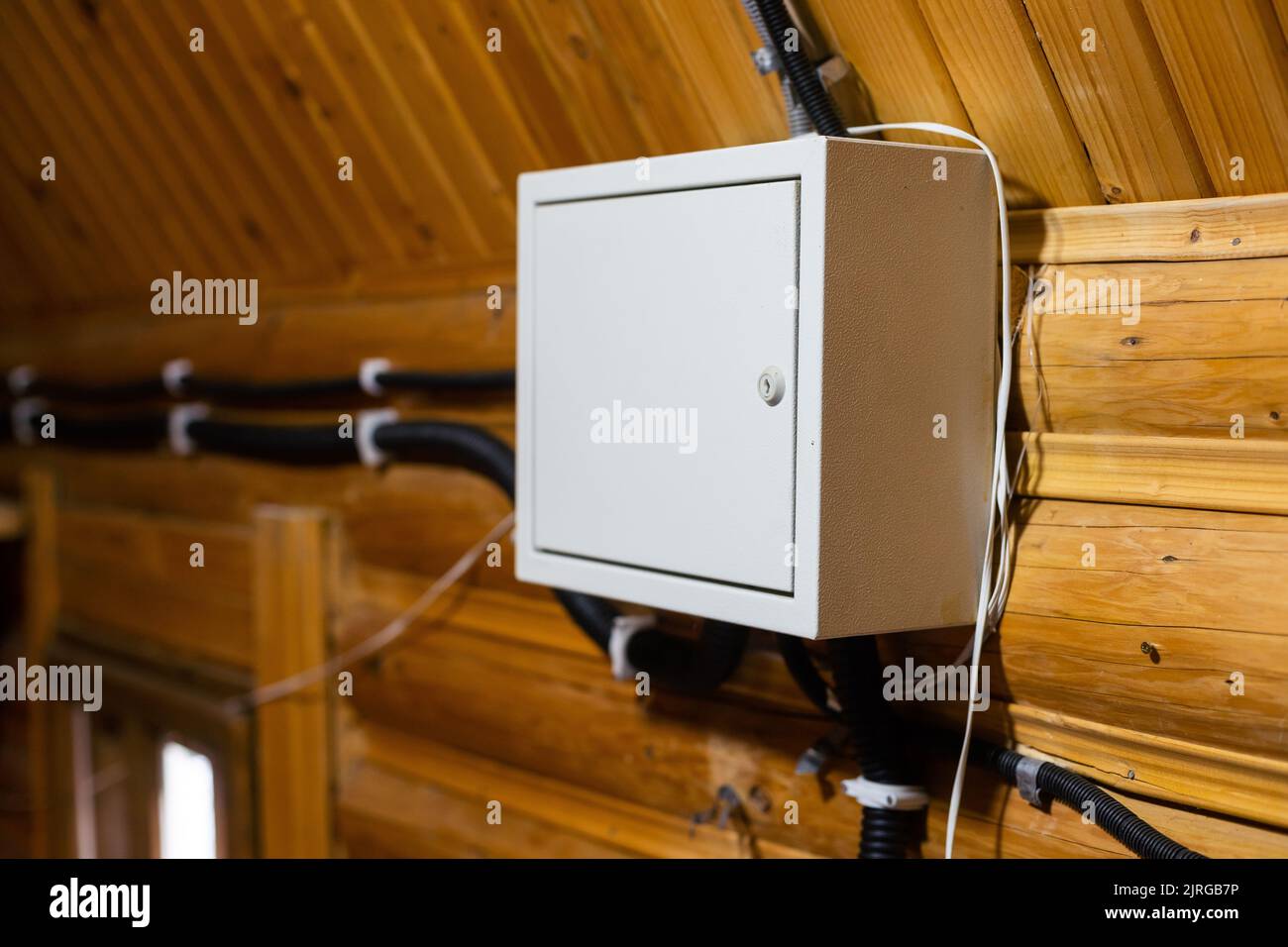 automatic fuses in electricity distribution box (fusebox) inside wooden ...