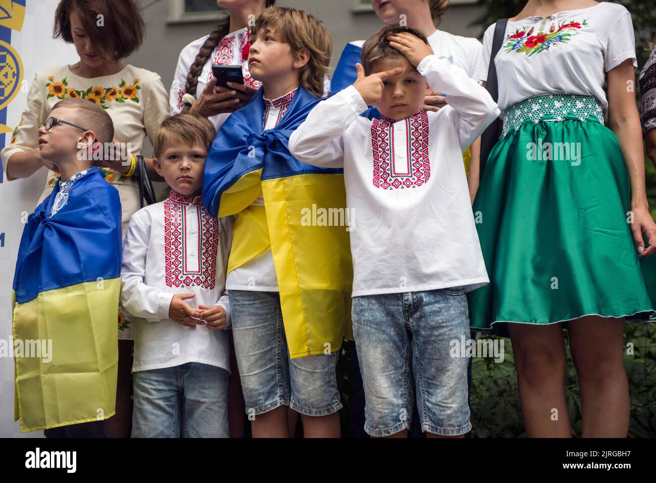 Ukrainian children are seen at the national anthem singing event in ...