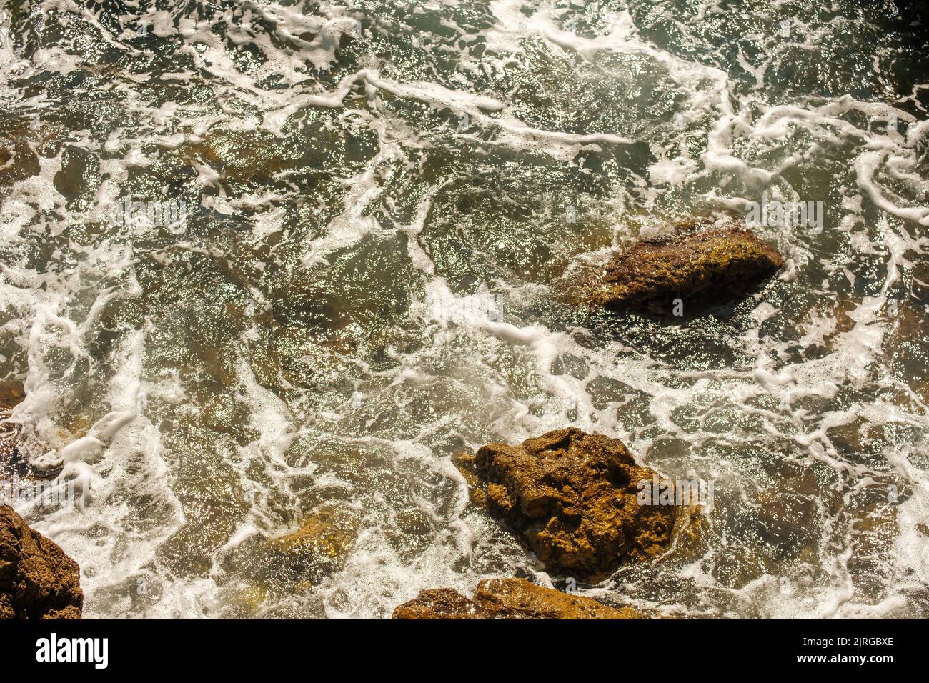 Sea waves breaking on rocks and hitting the shore Stock Photo - Alamy
