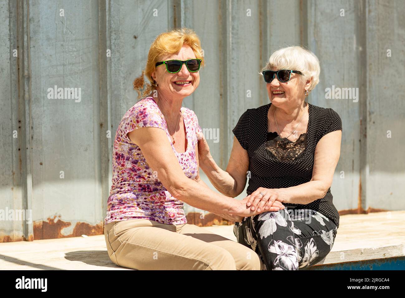 Two elderly women are happy to meet each other Stock Photo - Alamy