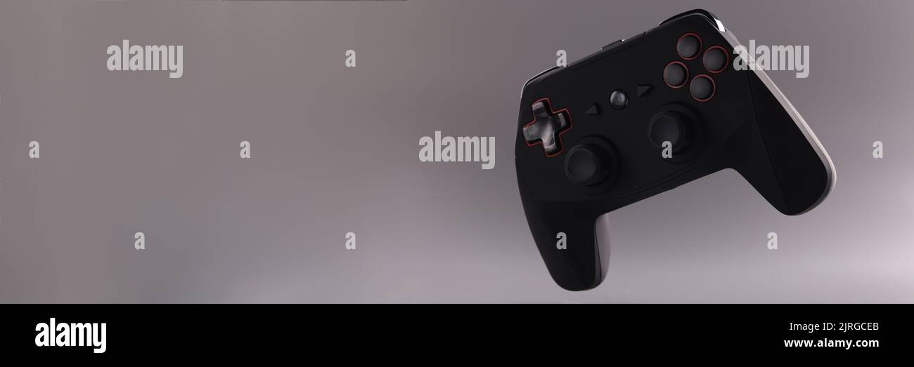 Black video game joystick or gamepad floating in air Stock Photo - Alamy