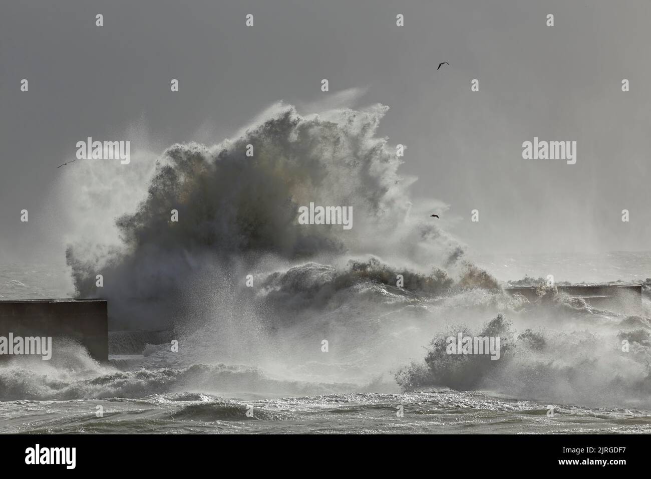 Big sea wave splash in a pier from northern portuguese coast with an ...