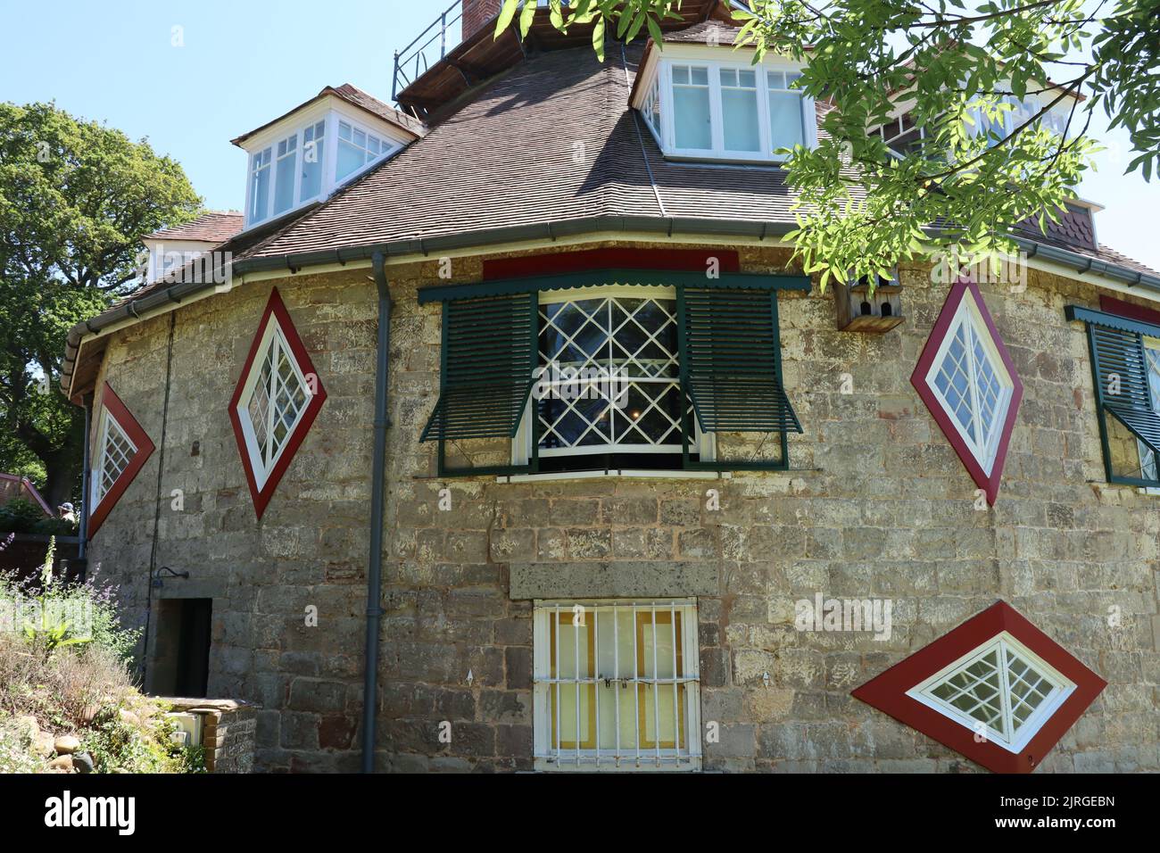 the strange shape of windows of an unusual historic sixteen sided house ...