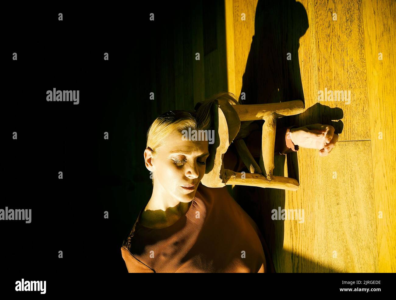 woman lying and leaning on a stool III Stock Photo - Alamy