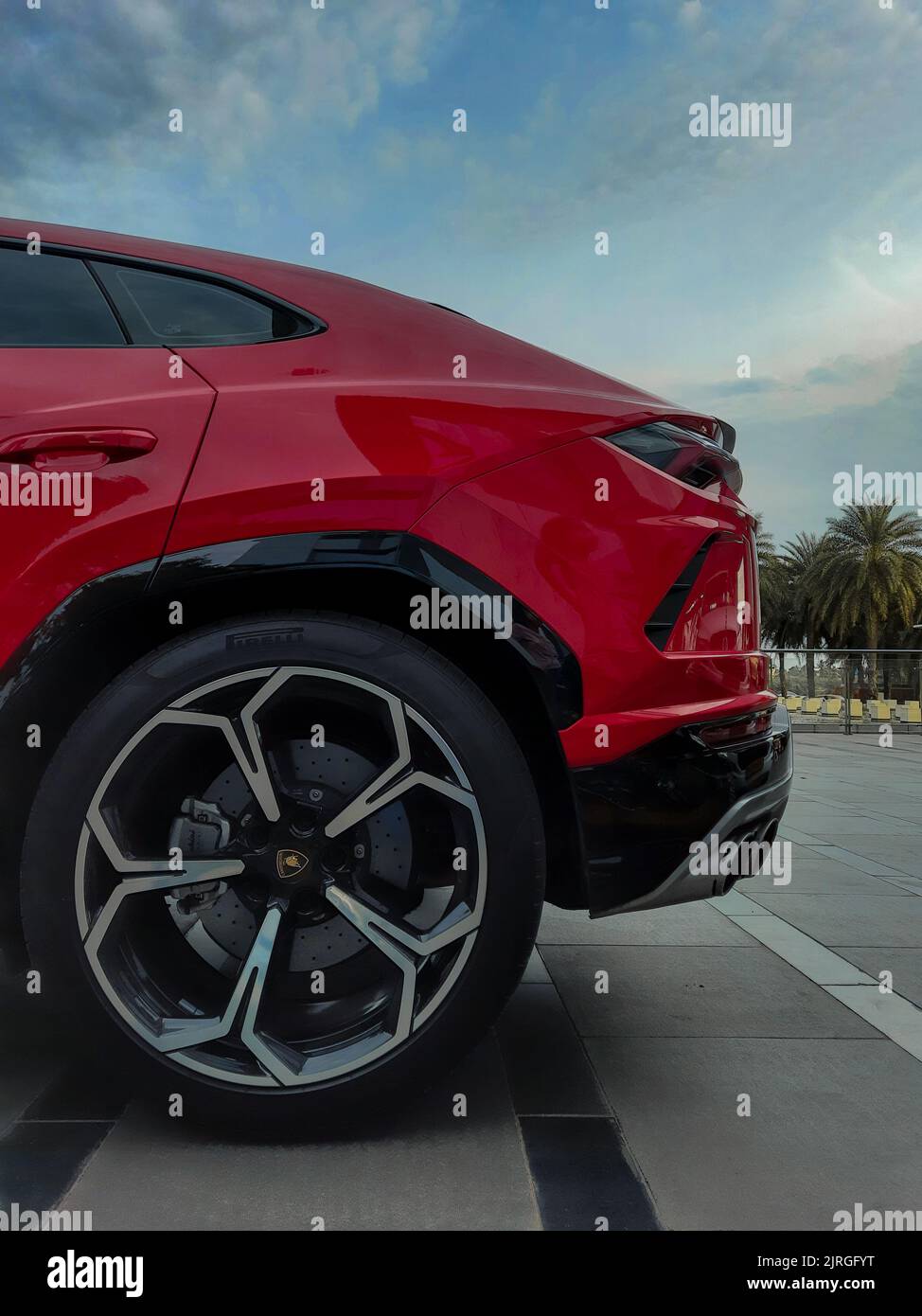 A vertical closeup of the rear side of a red Lamborghini Urus Stock ...