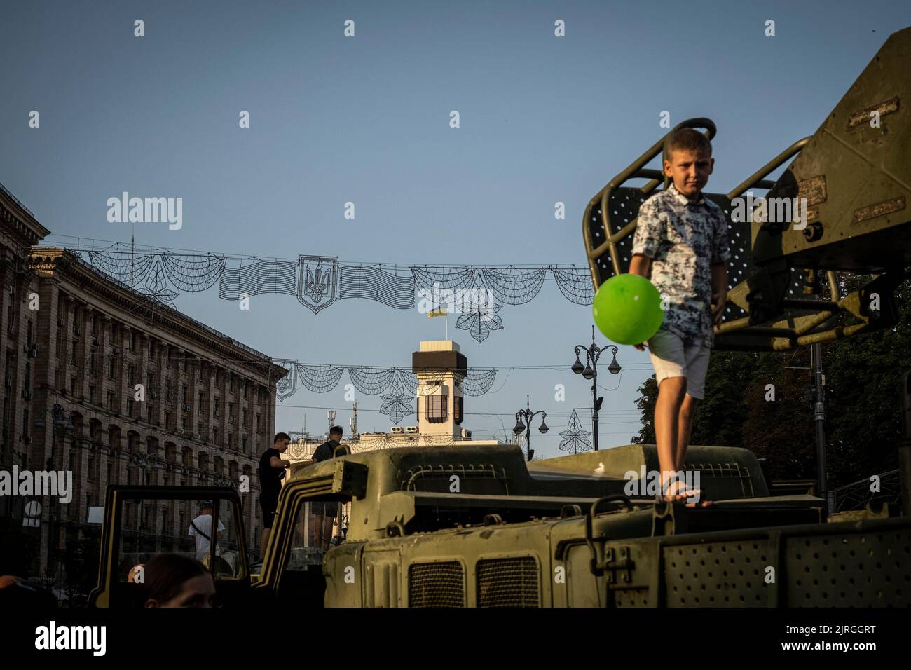 People stand on the display of destroyed Russian military equipment on ...