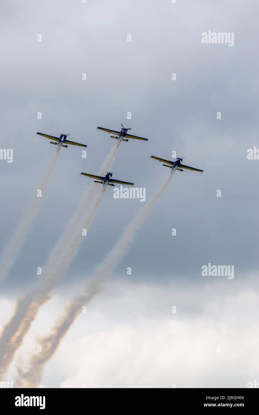 An airplanes show in the sky at Hangariada aeronautical festival in ...