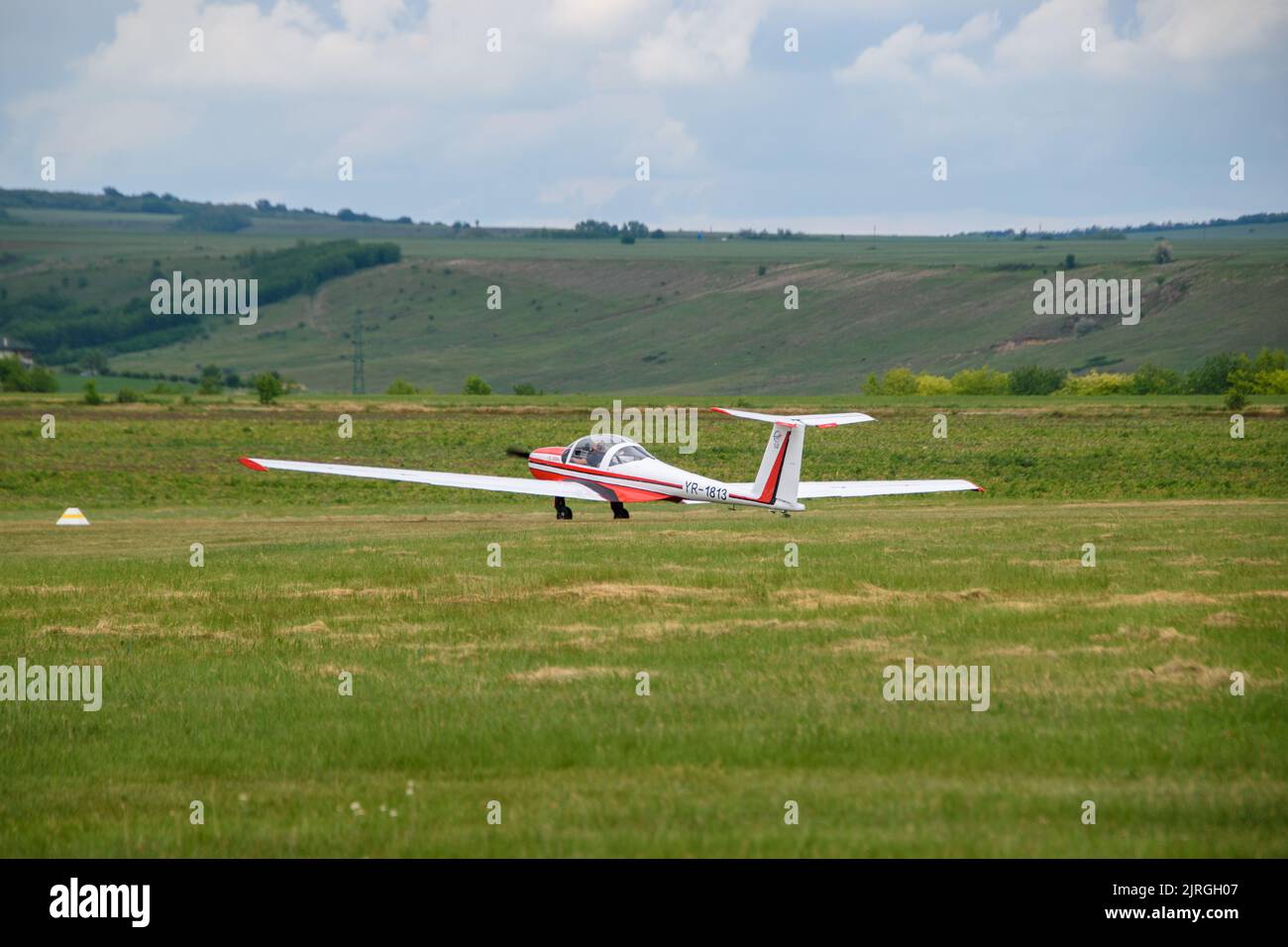 An airplane in a greenery landscape at Hangariada aeronautical festival ...
