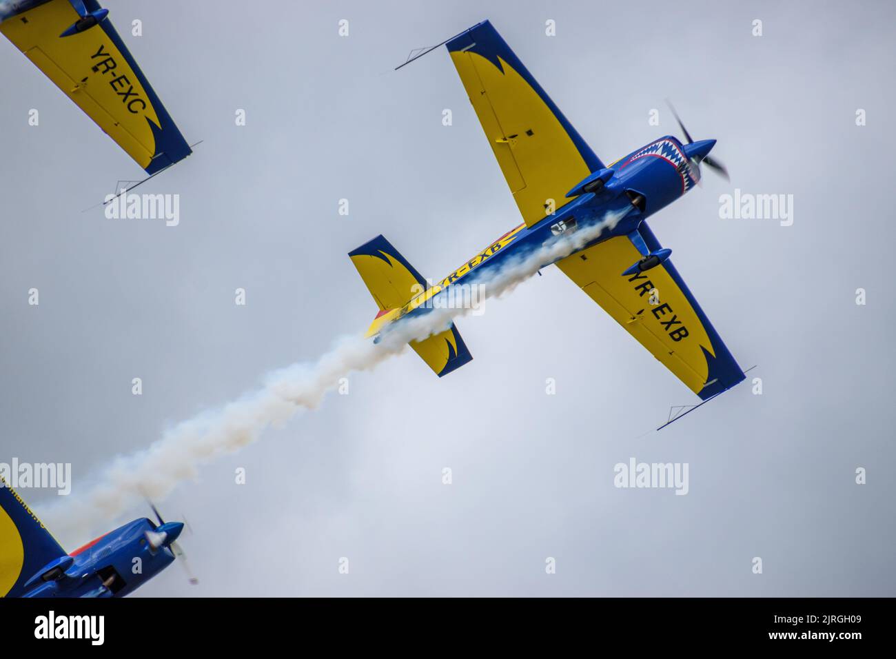 An airplanes show in the sky at Hangariada aeronautical festival in ...