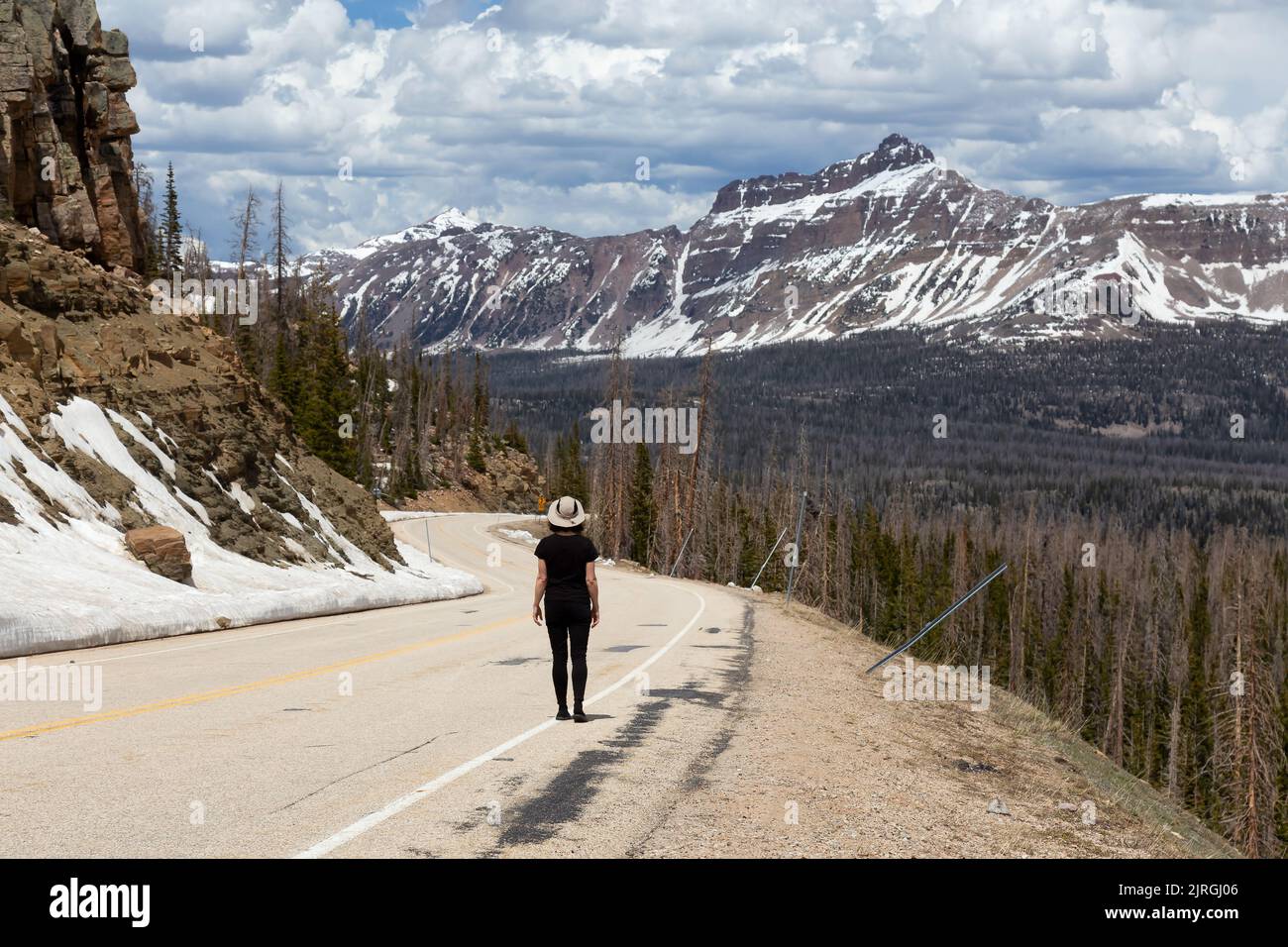 Woman walking on rocky road hi-res stock photography and images - Alamy