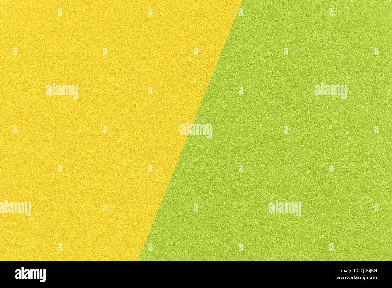 Texture of craft green and yellow paper background, half two colors ...