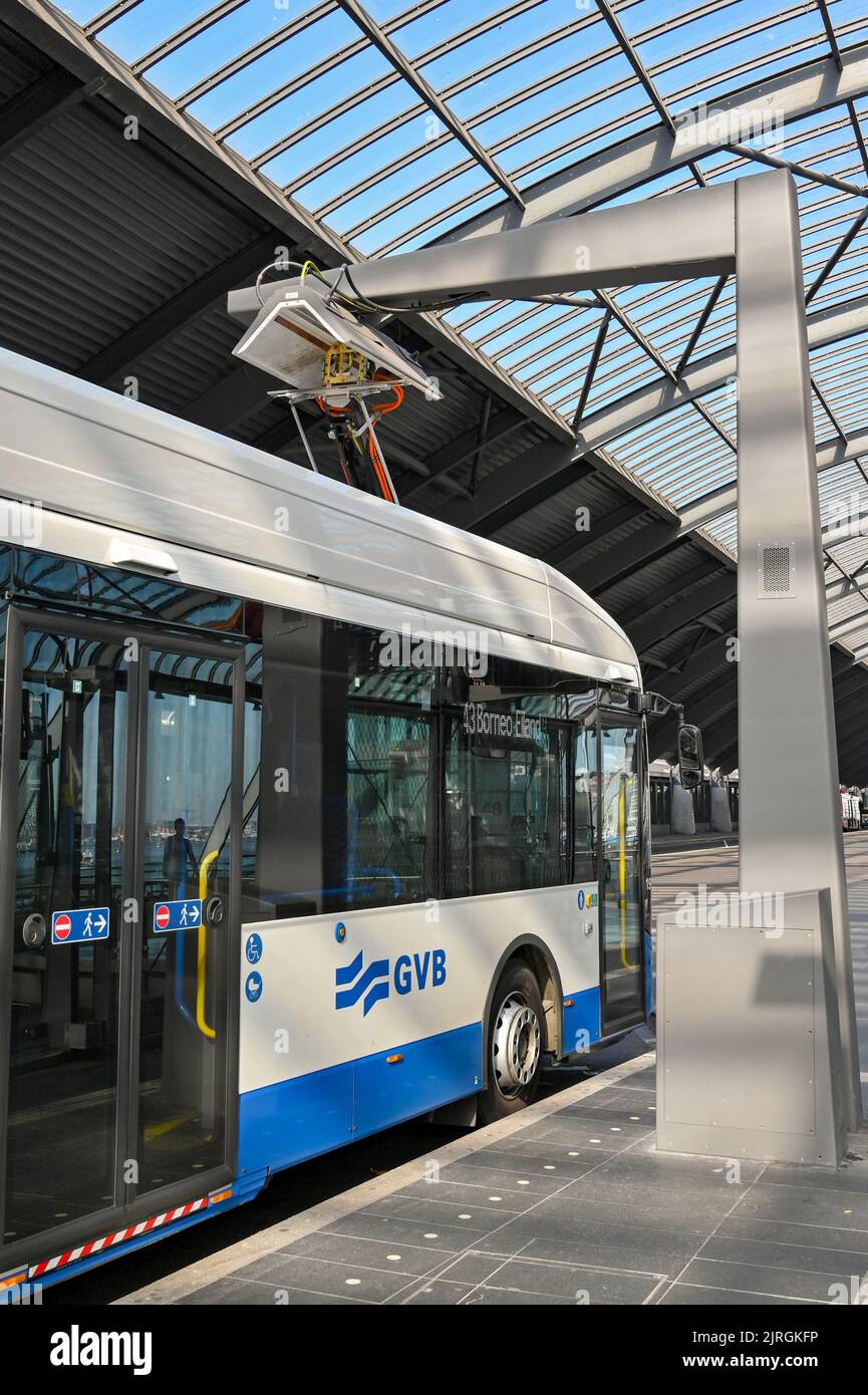 Amsterdam, Netherlands - August 2022: Public service bus connected to a ...